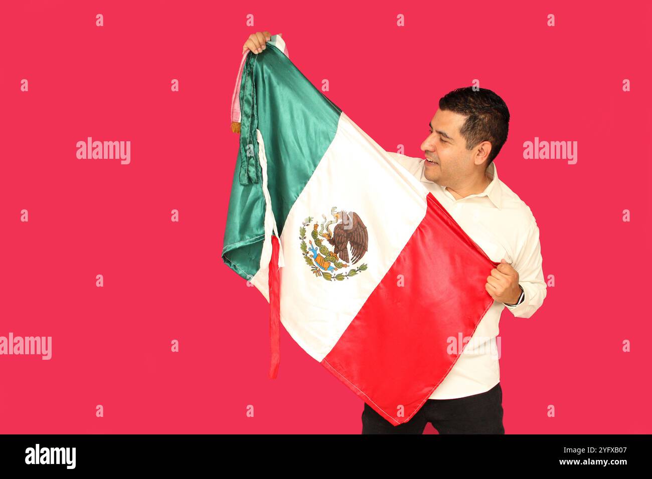 40-year-old dark-skinned mexican man proudly shows the flag of Mexico ...
