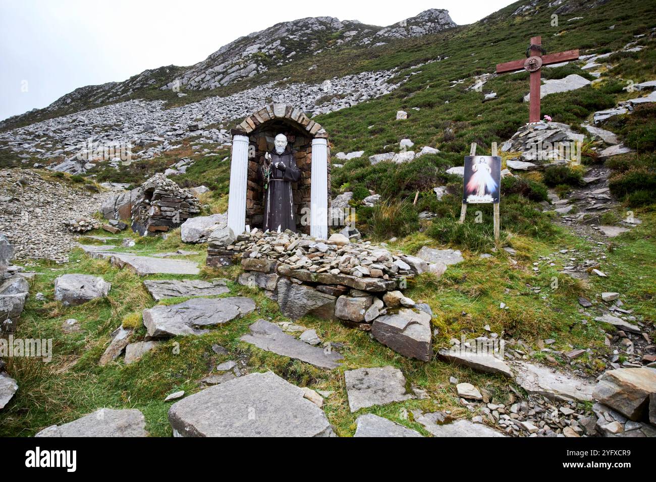 statue of padre pio and cross at the holy well and grotto on the gap ...
