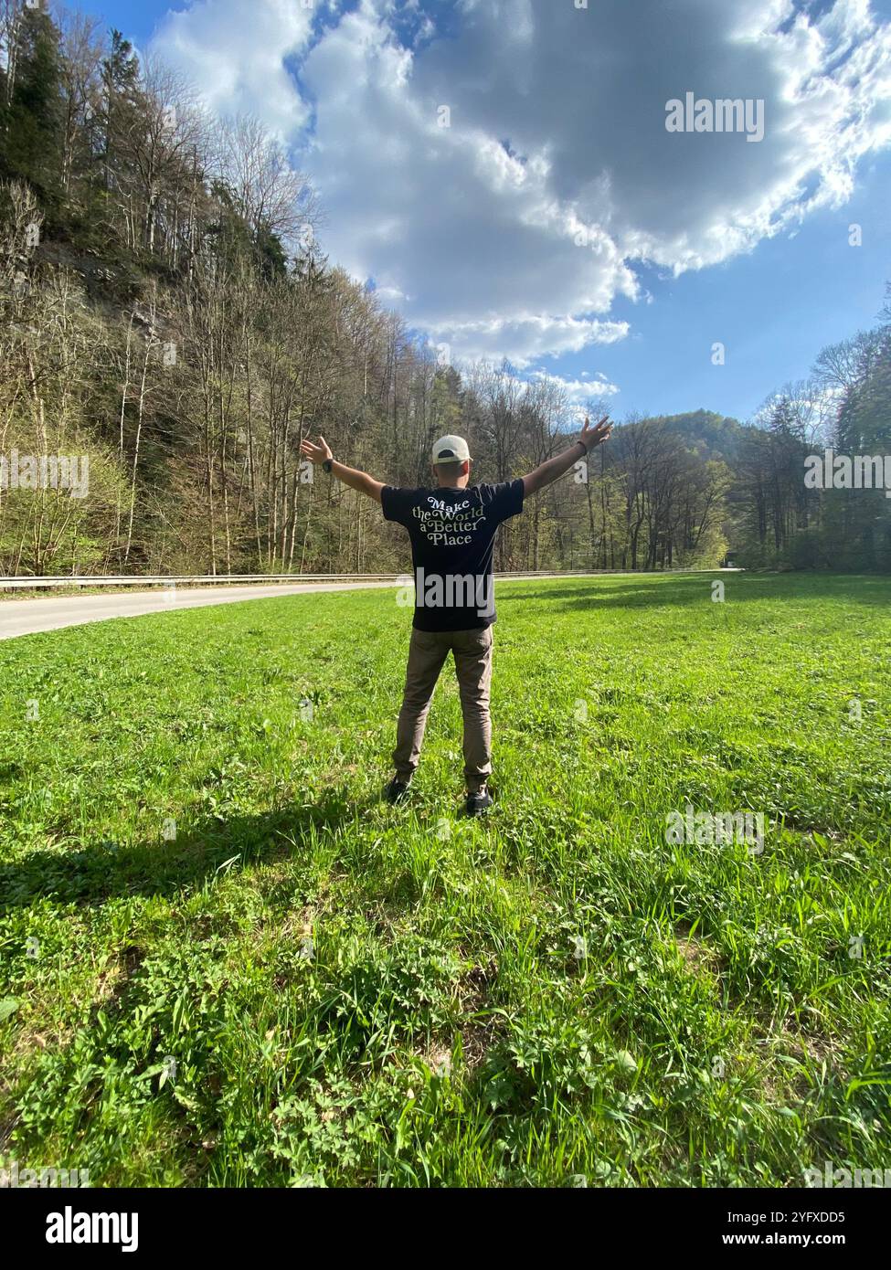 Person stands outdoors enjoying greenery hi-res stock photography and ...