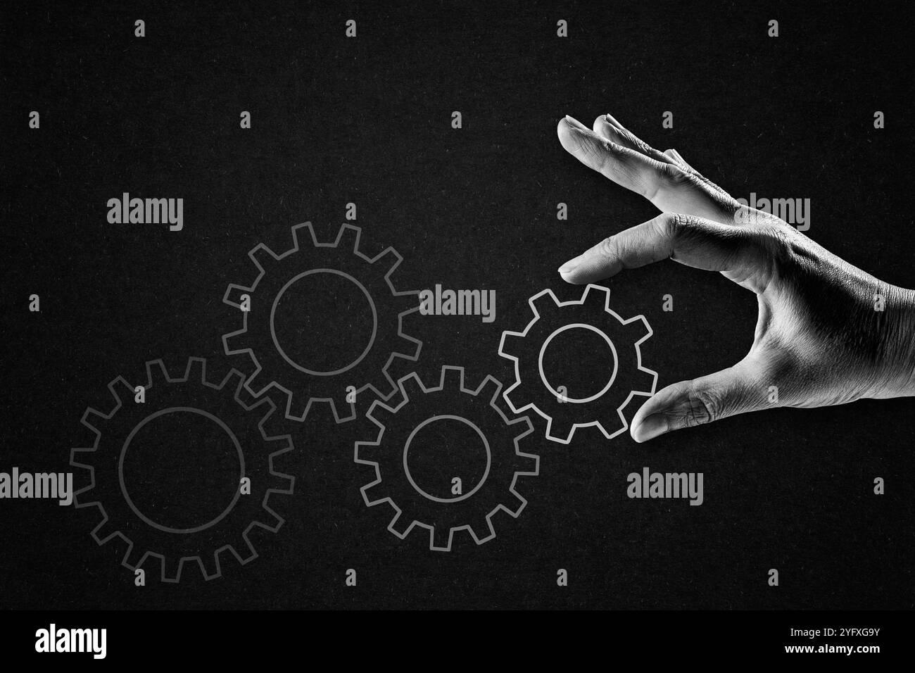 Hand Turning Gear Sign in Black and White on Textured Paper Background ...