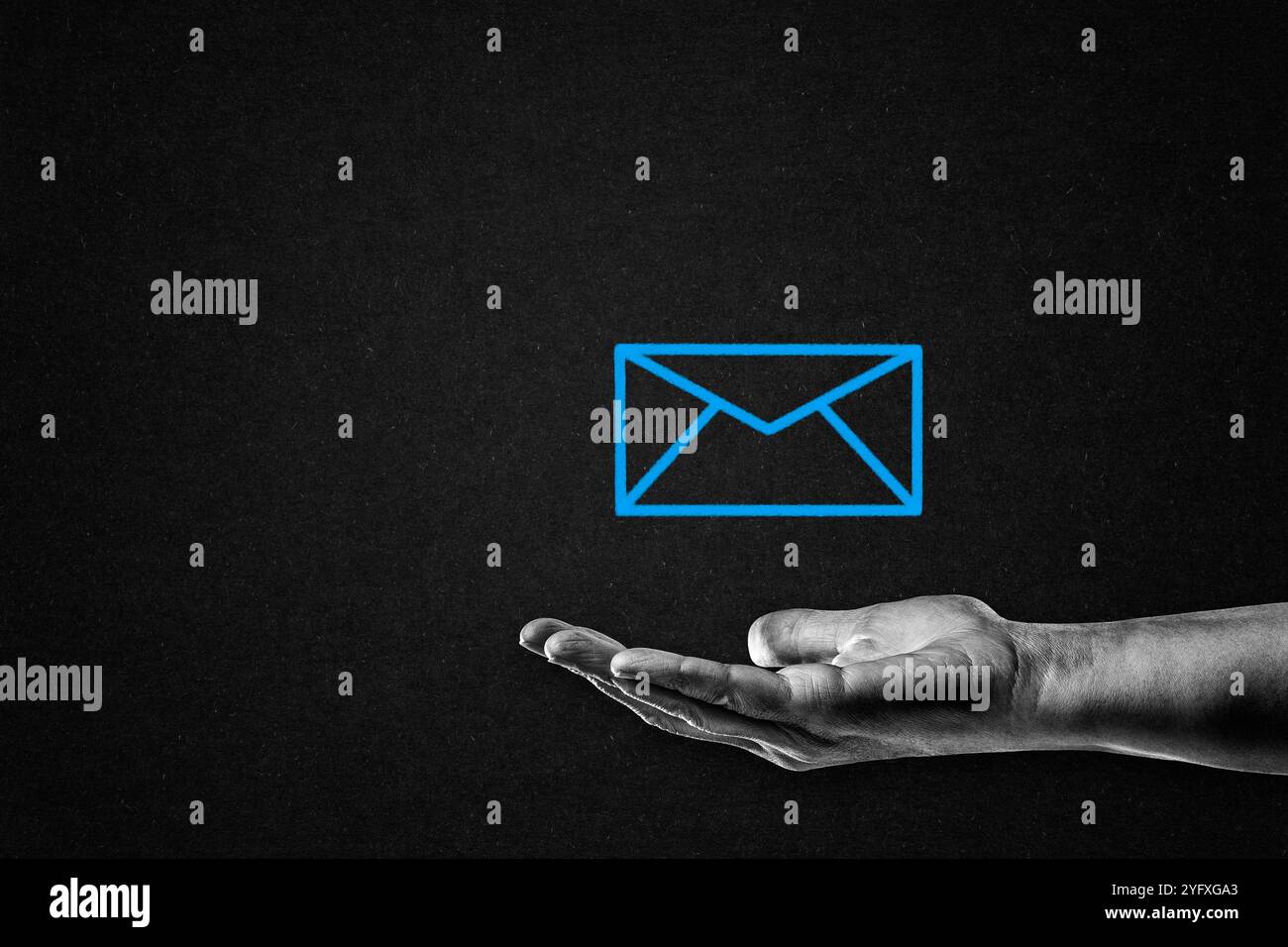 Hand Holding Blue Email Sign in Black and White on Textured Paper ...