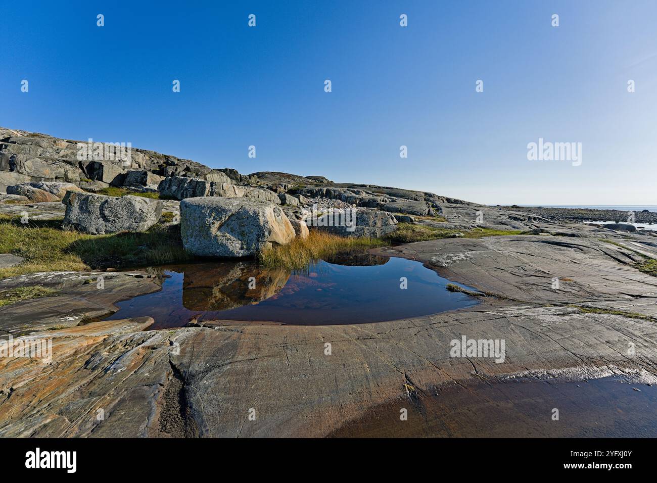 Water puddle on the skerry island of Roeroe Stock Photo - Alamy