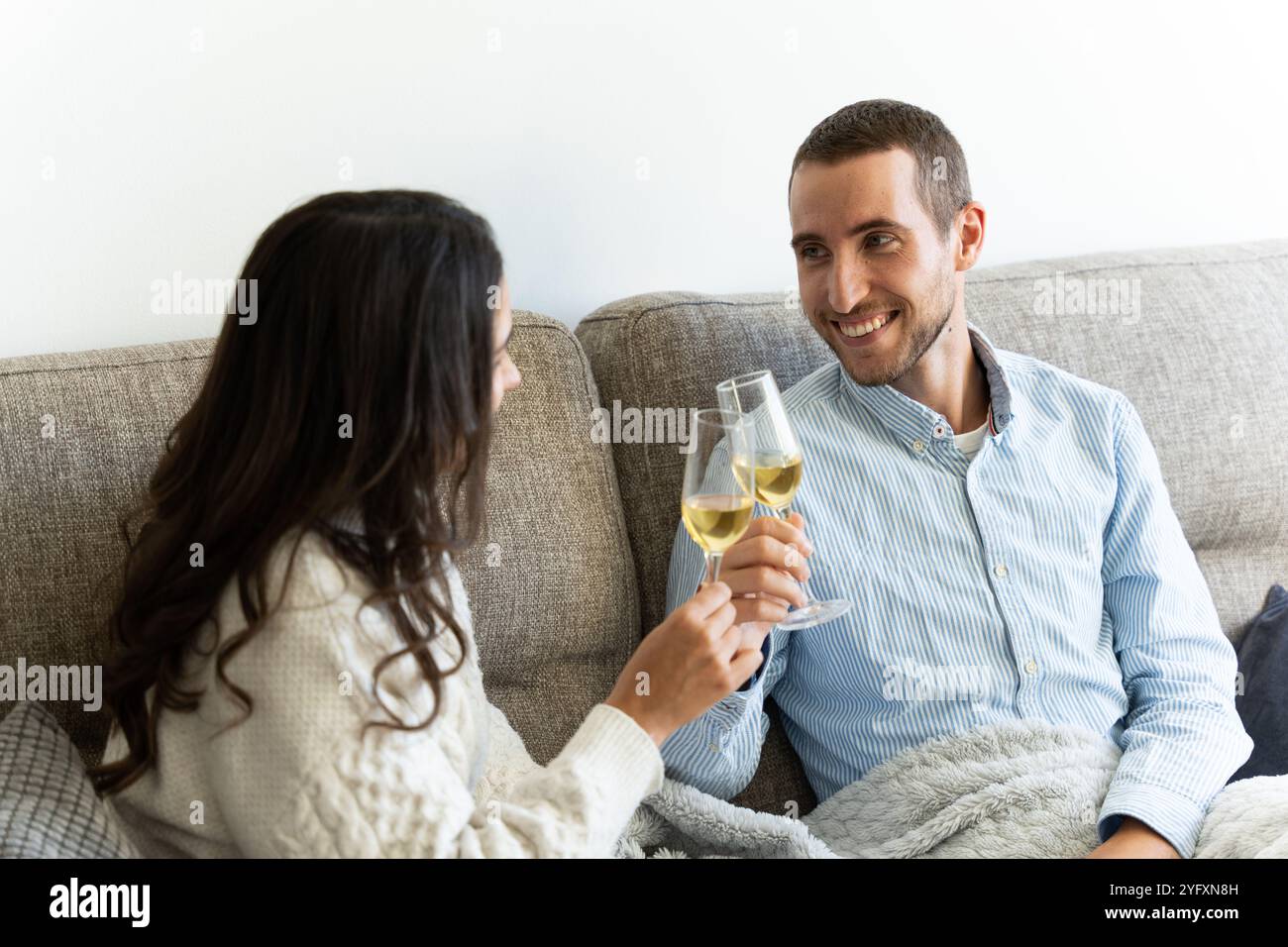 Couple flirting on sofa hi-res stock photography and images - Alamy