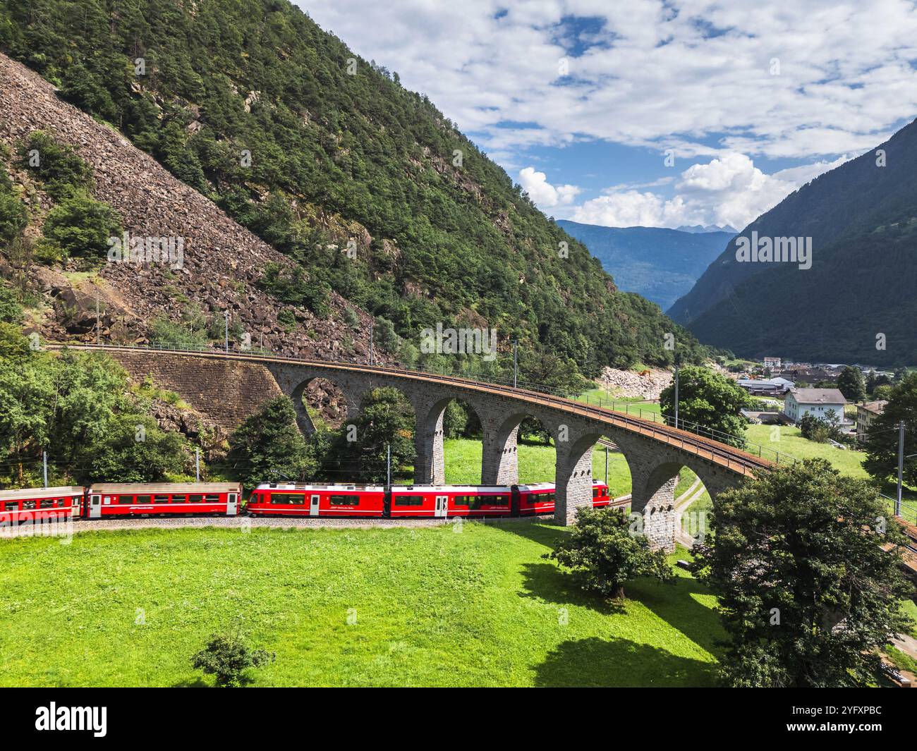 Aerial view of a Bernina Express train crossing the Brusio spiral ...