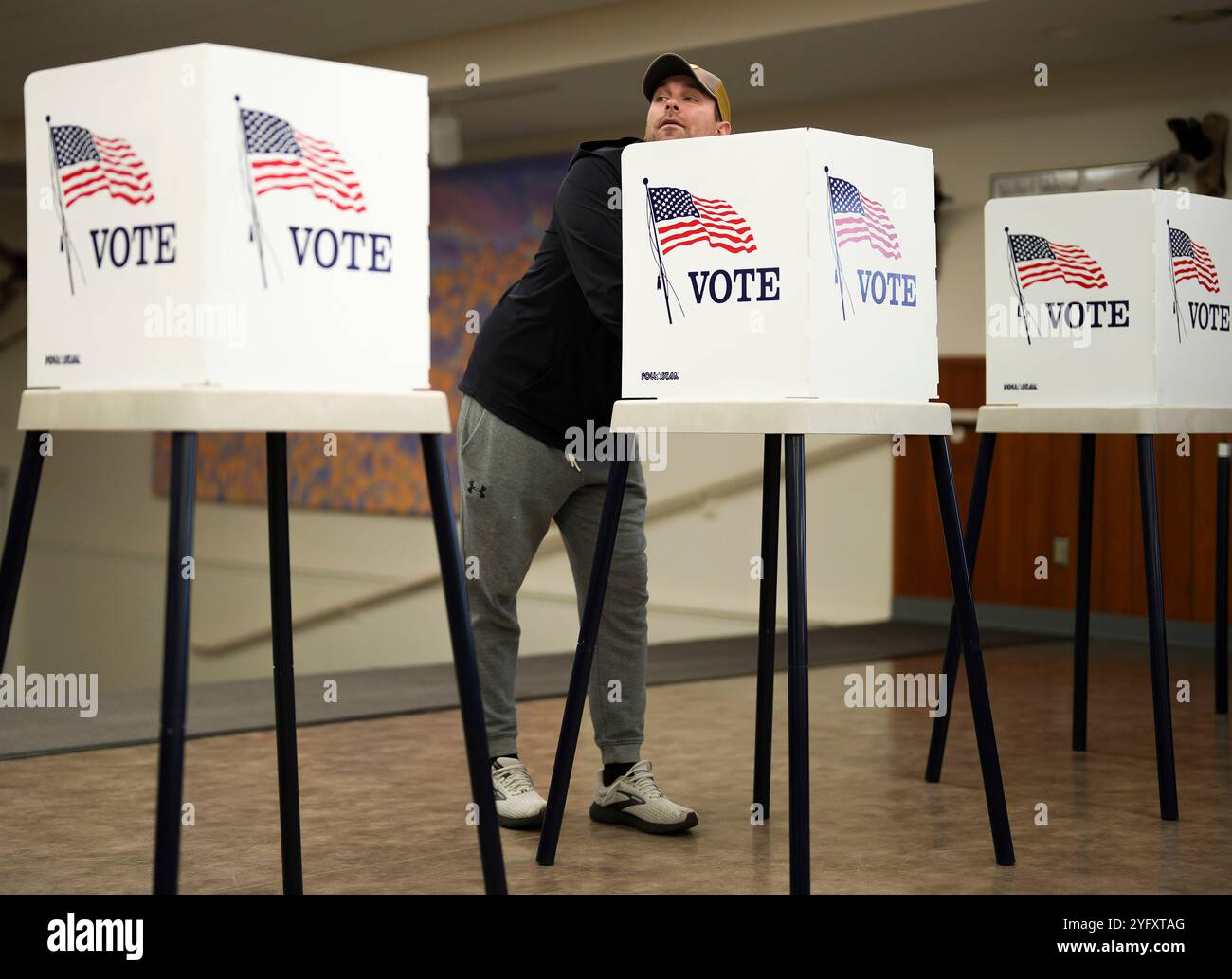 Alexander Johnson of Ames, Iowa, looks over at his young children as he ...
