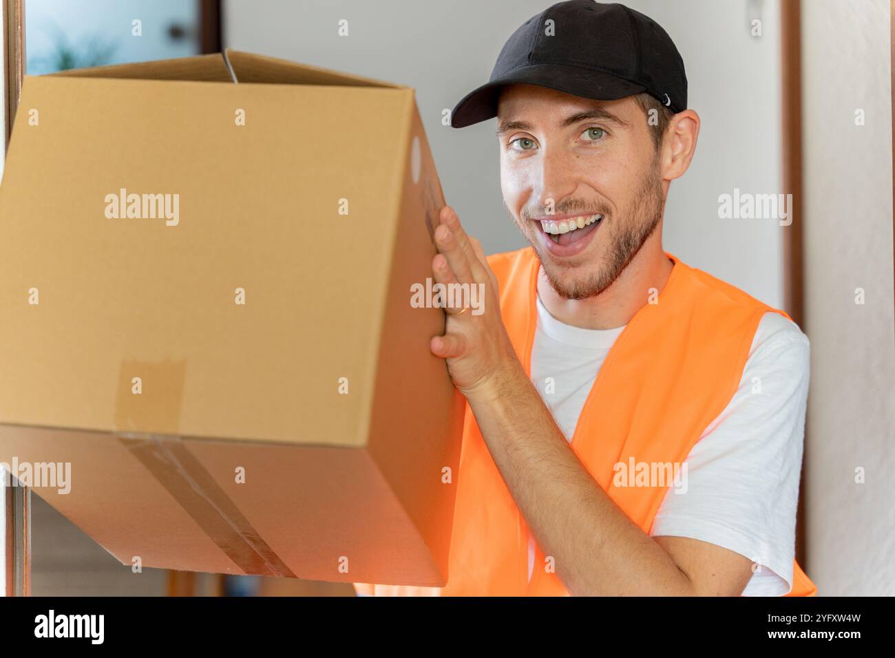 Delivery man surprising a customer with an unexpected package. Concept ...