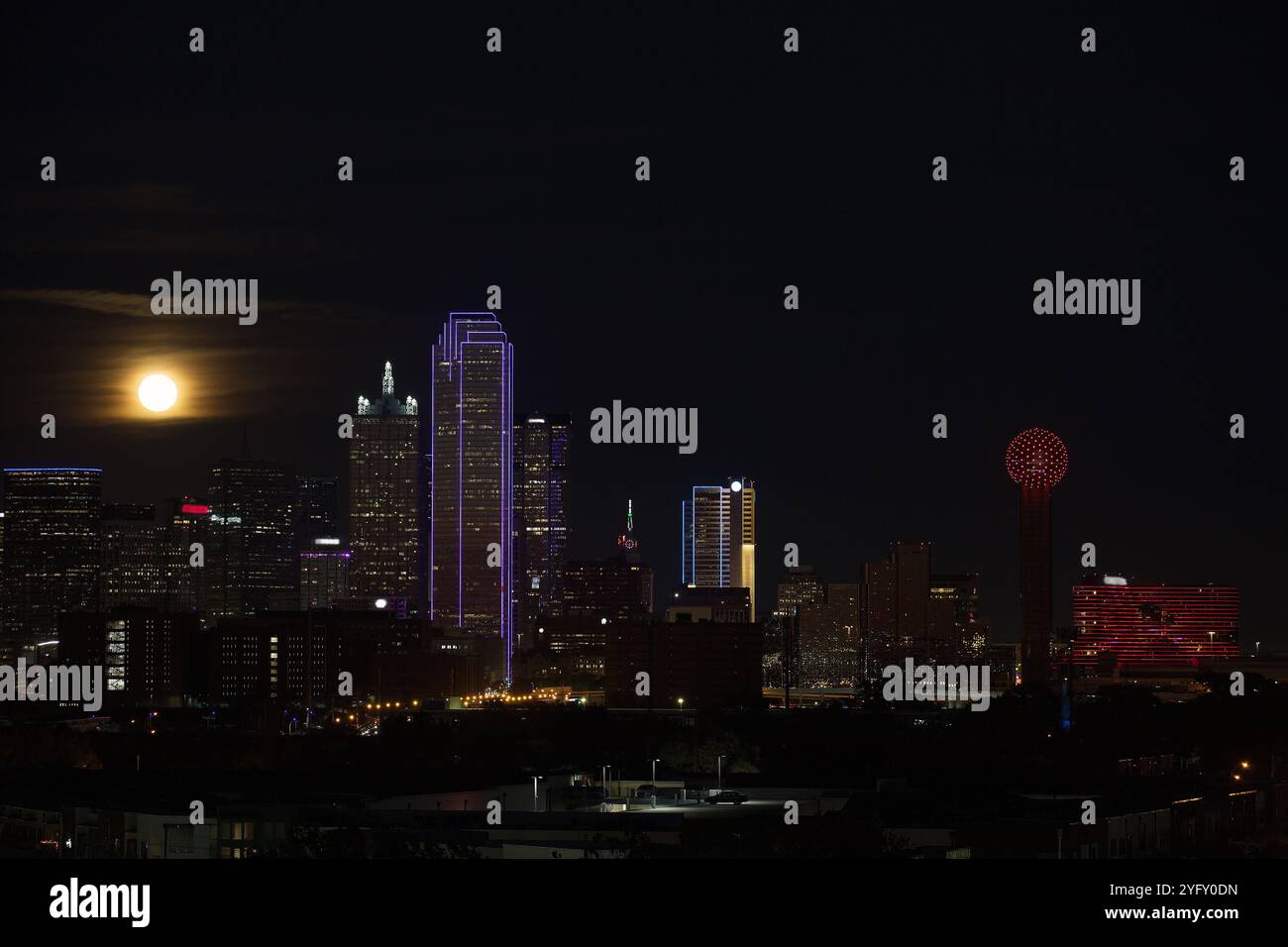 Eerie Moon Glows Through Clouds Rising Over The Downtown Dallas, Texas ...