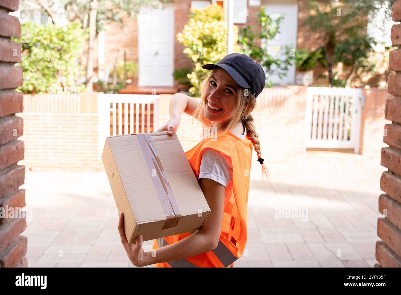 Young beautiful blonde woman holding delivery boxes. Home delivery ...