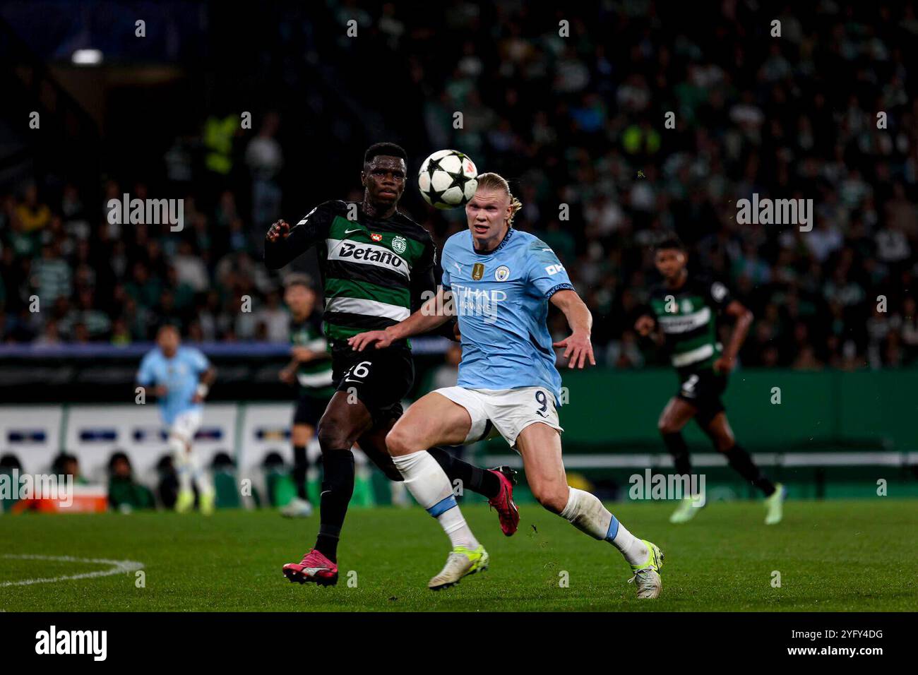 Erling Haaland forward of Manchester City bath for the ball with ...