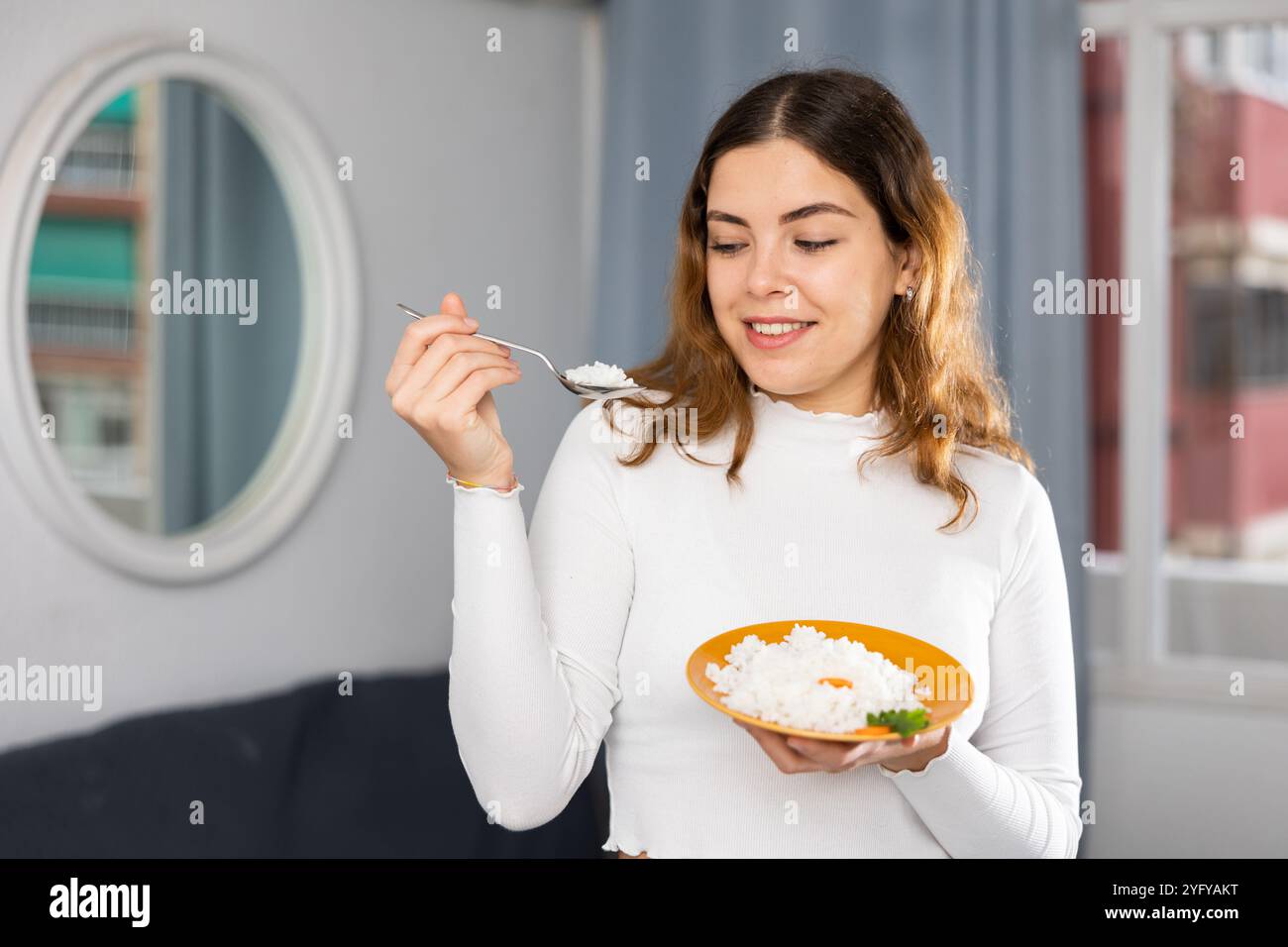Woman alone eating rice hi-res stock photography and images - Alamy