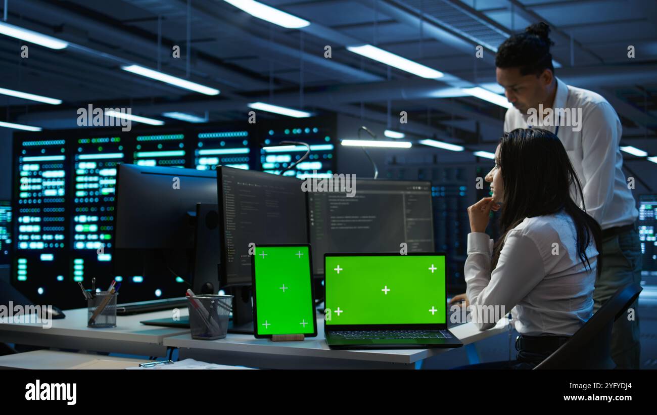 Engineers In Data Center Monitoring Security Threats Using Chroma Key Devices Experts Using