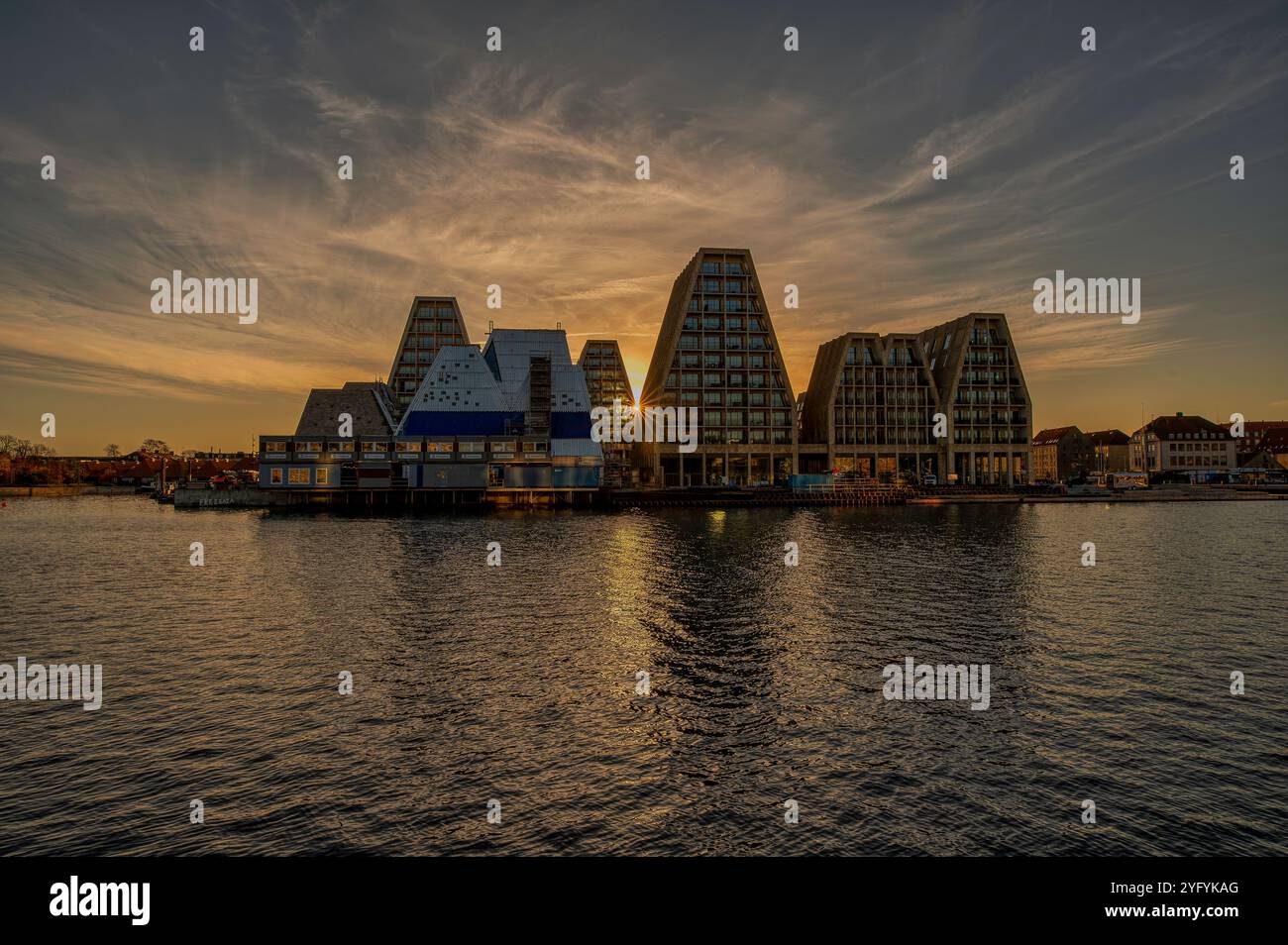 Papiroen in Copenhagen with the sunrise behind modern residential ...