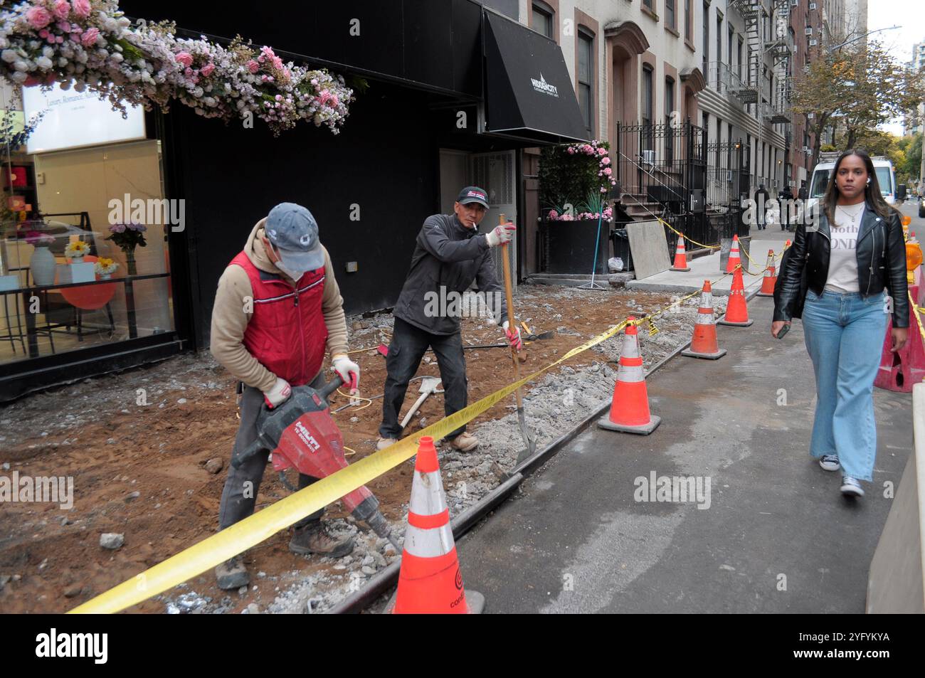 Construction workers work on the street in Manhattan, New York City ...