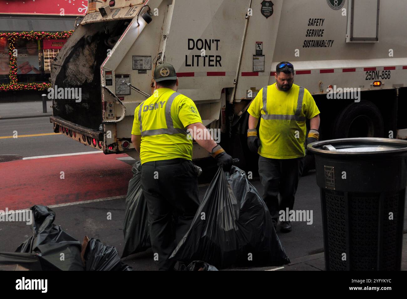 Members of the New York City Department of Sanitation collect garbage ...