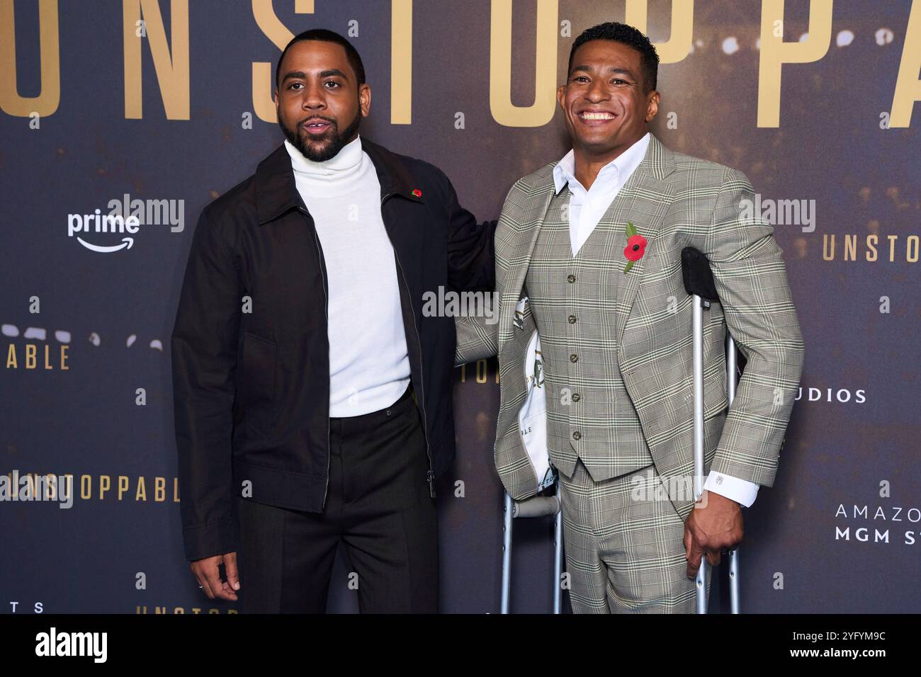 Jharrel Jerome, left, and Anthony Robles pose for photographers upon ...