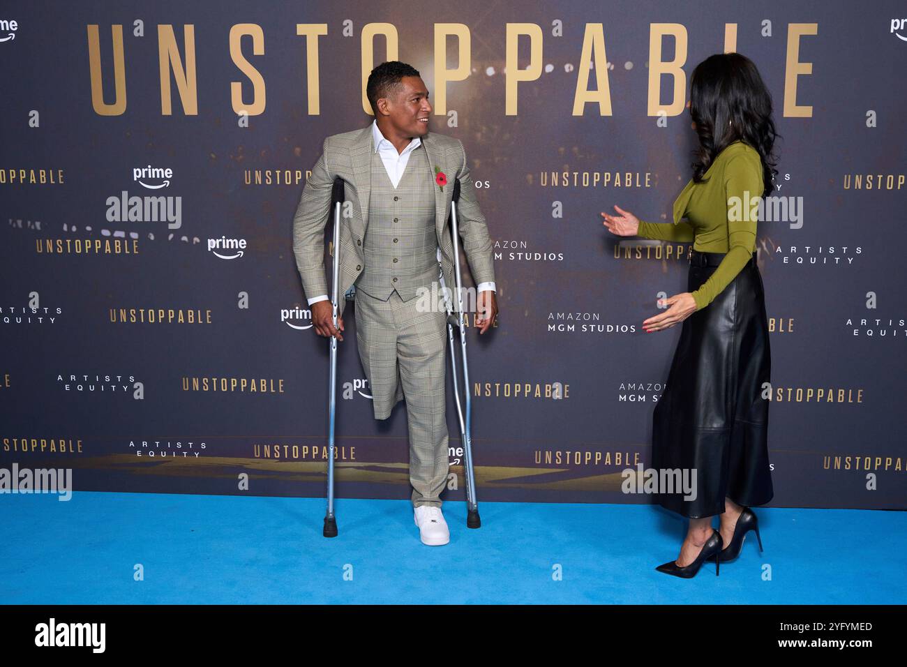Judy Robles, right, and Anthony Robles pose for photographers upon ...