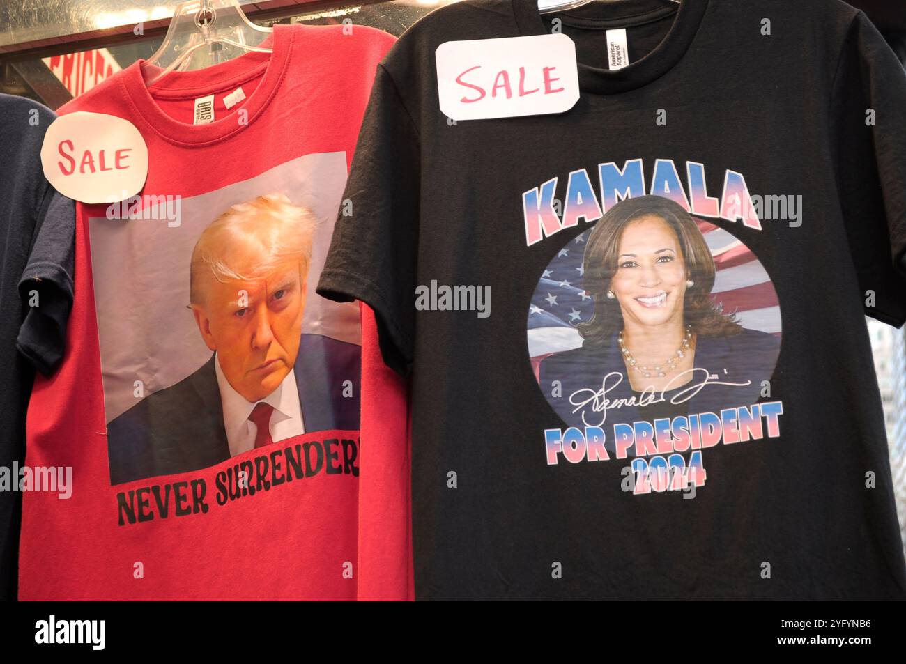 T-shirts of Donald Trump, left, and Kamala Harris, right, are seen ...