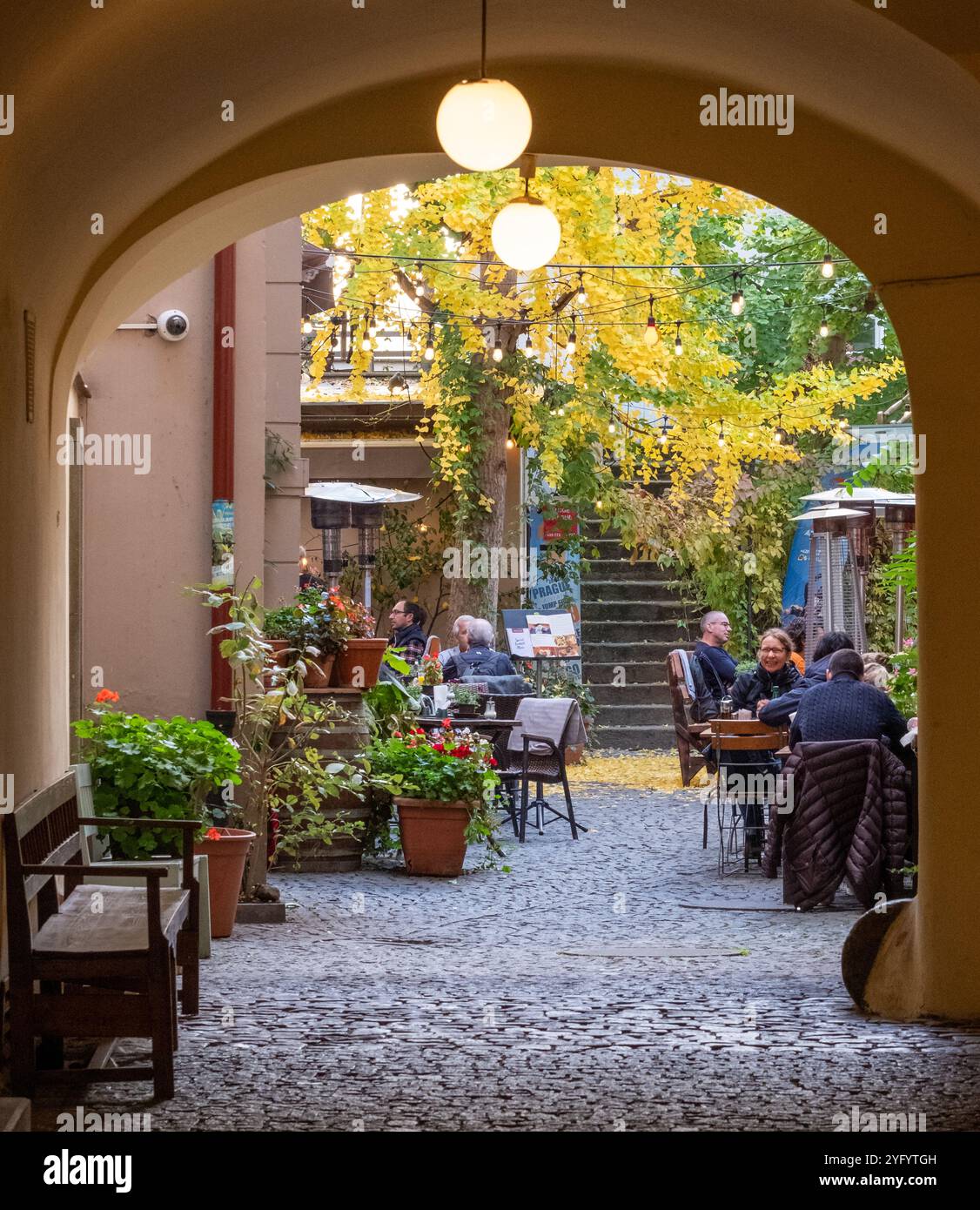 Scene in Prague Old Town, Czechia, in autumn, of enclosed passage with ...