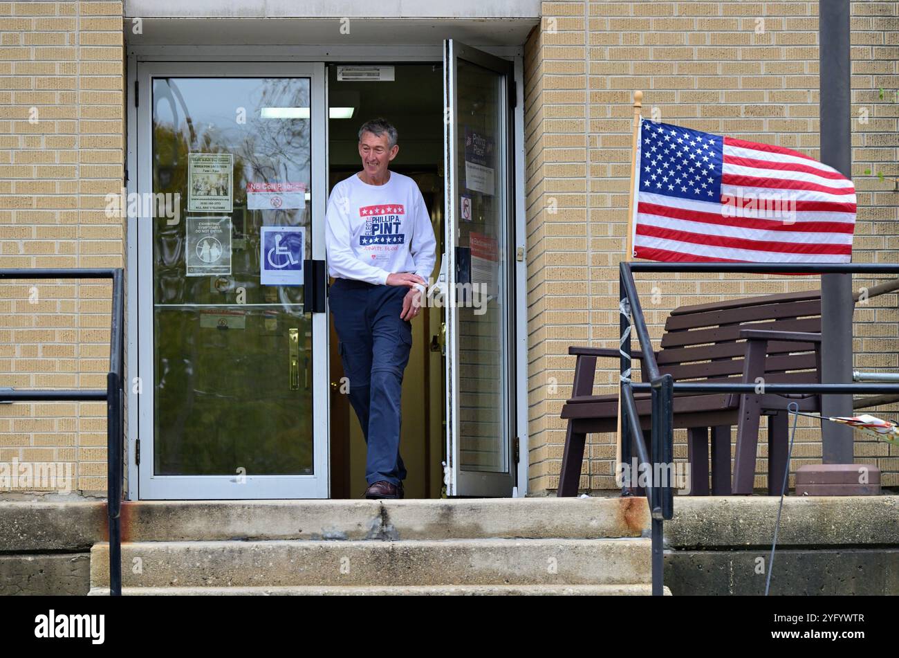 Wheaton, Illinois, USA. Man exiting a polling place in suburban Chicago ...
