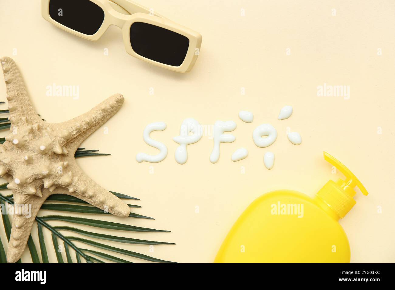 Composition with bottle of sunscreen cream, sunglasses and word SPF ...