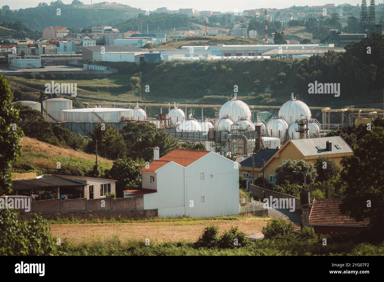 Industrial landscape featuring spherical gas storage tanks, pipelines ...