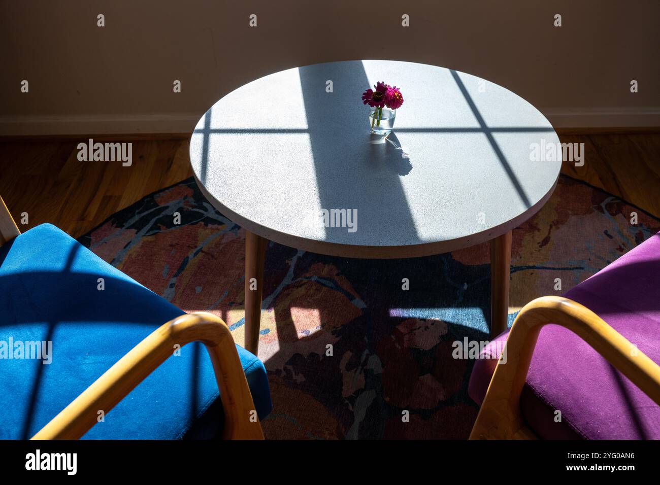 Afternoon sunlight casts long shadows inside the tasting room of a ...