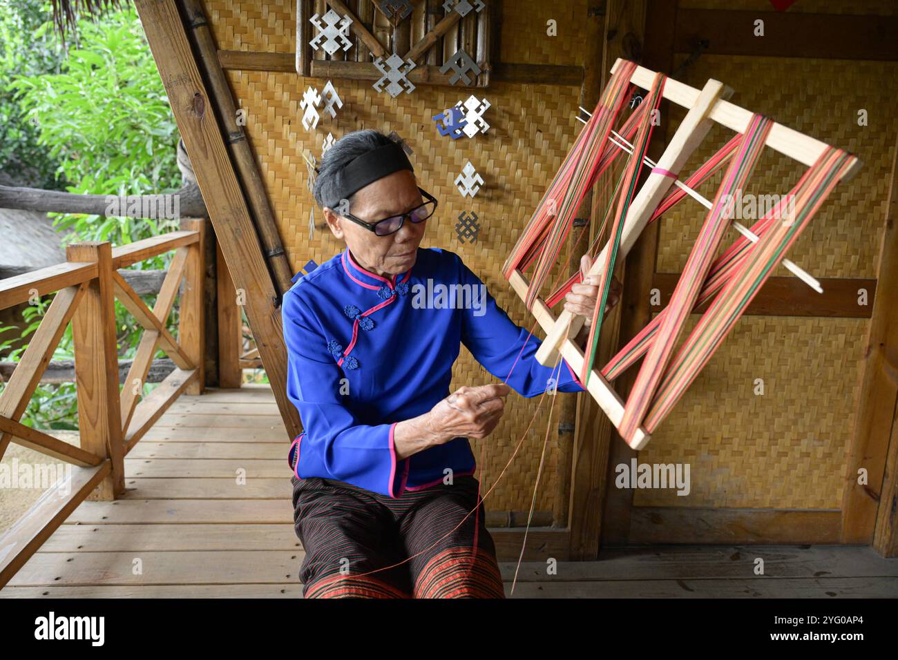 Baoting, China's Hainan Province. 4th Nov, 2024. A senior Li woman ...