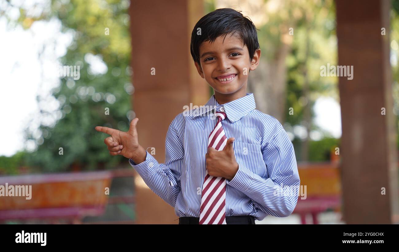 Portrait of Happy cheerful Indian school child or kids in uniform ...