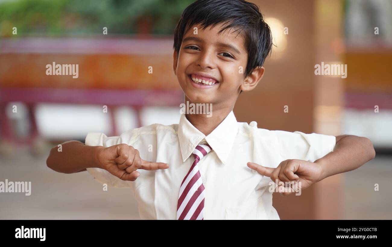 Happy Indian elementary school girls students sitting at desk in ...