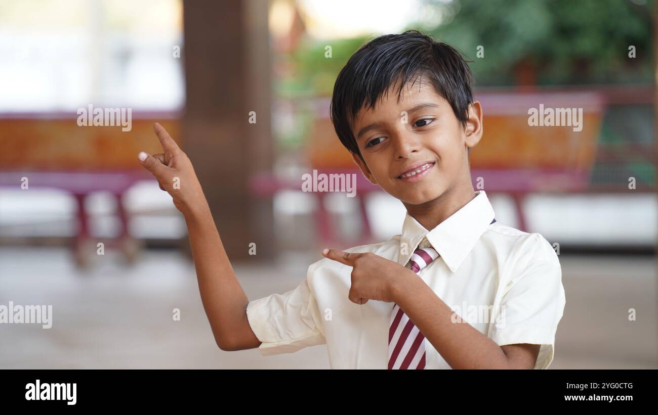 Portrait of Happy cheerful Indian school child or kids in uniform ...