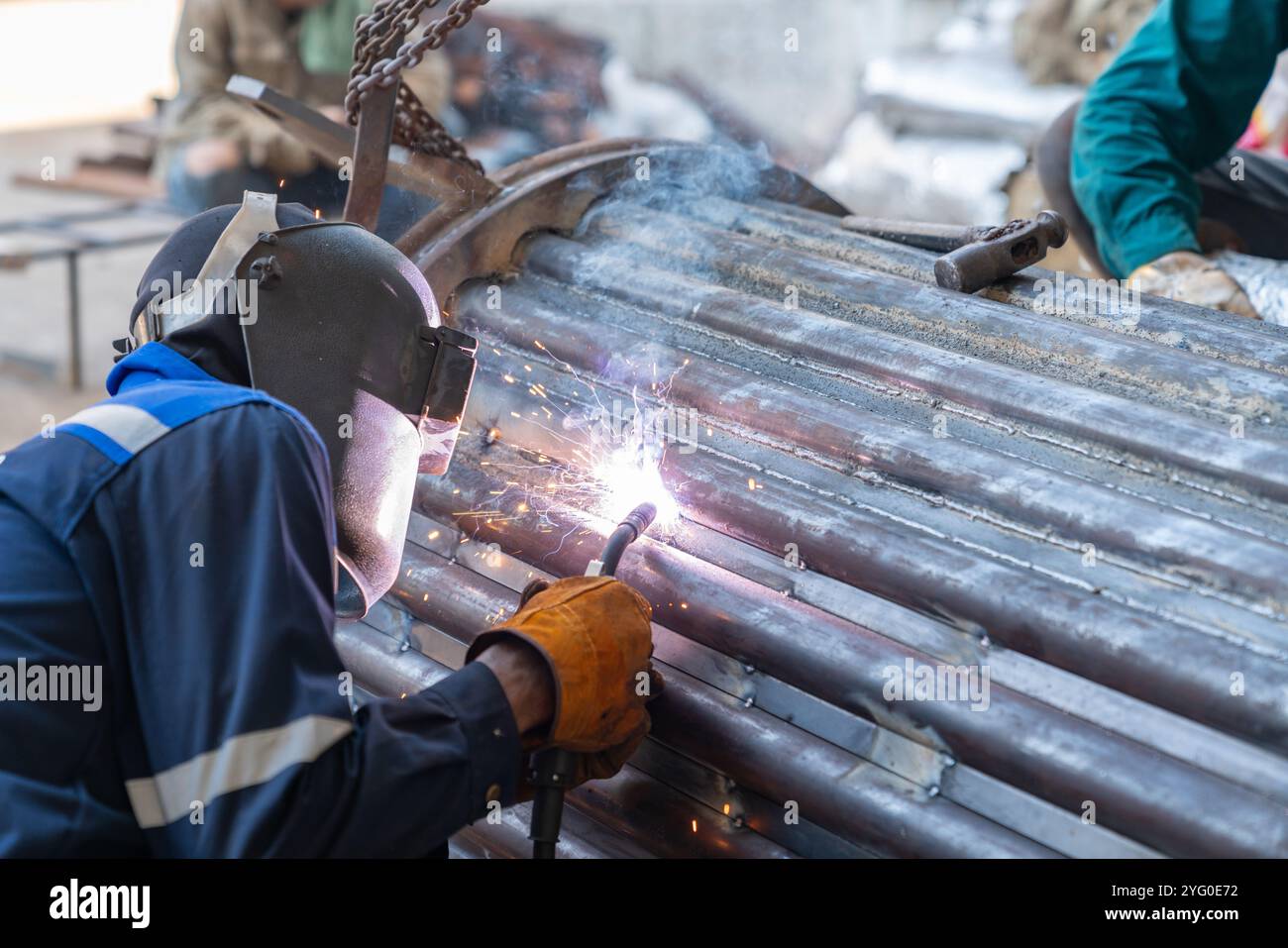 Welder welding steel tube of boiler with argon torch in factory Stock ...