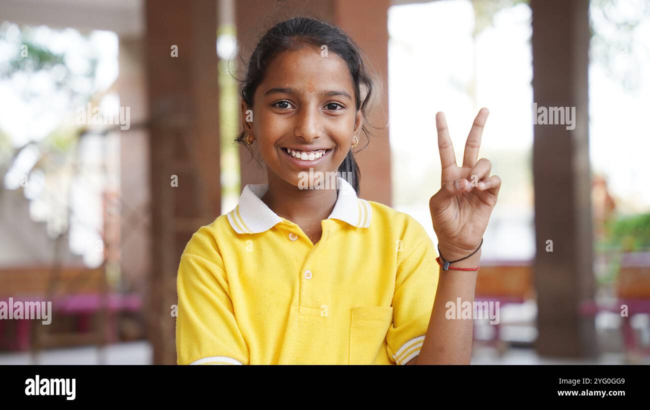 Portrait of Happy cheerful Indian school child or kids in uniform ...