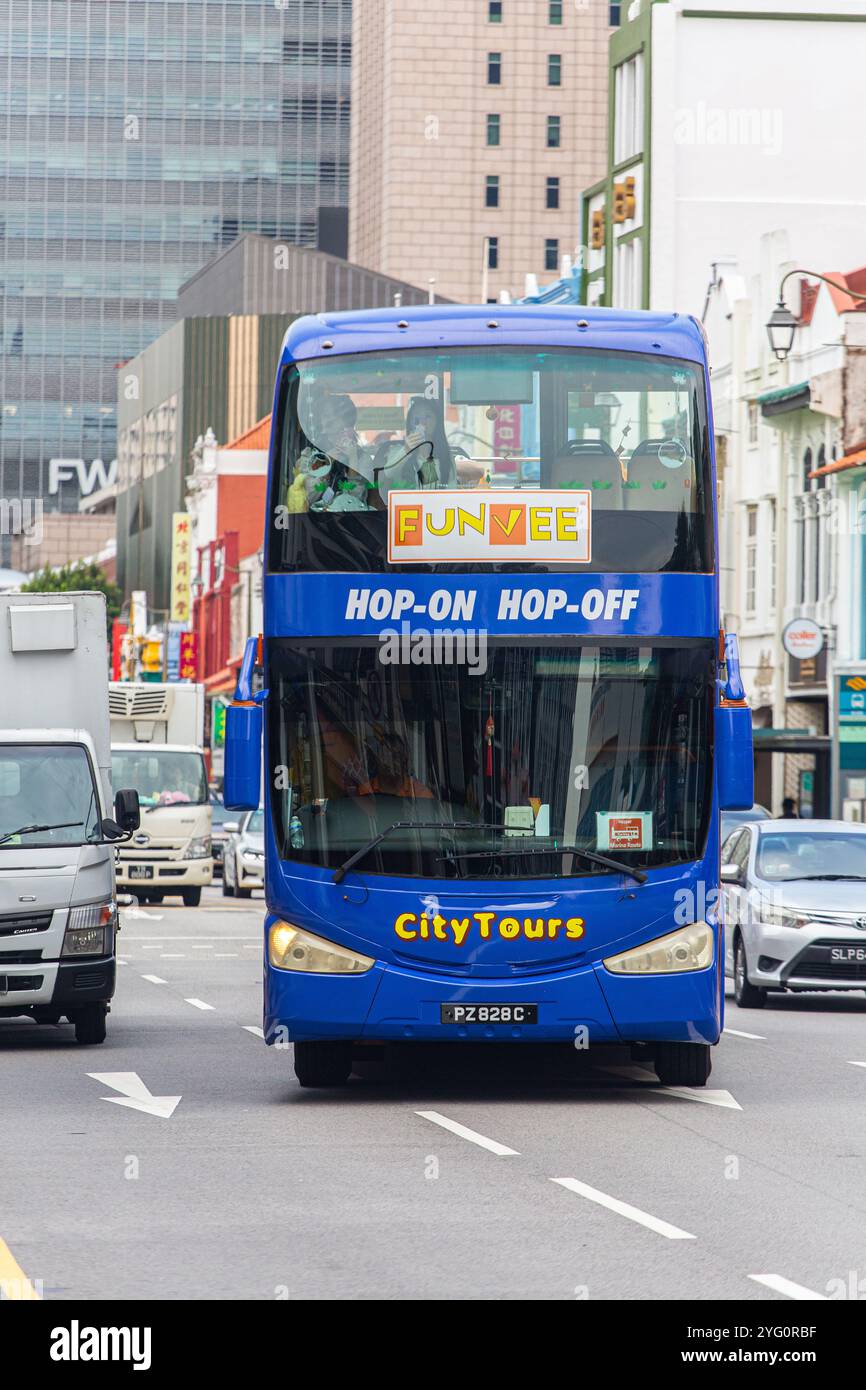 City Tours blue colour double decker bus on busy road, ferry tourists ...