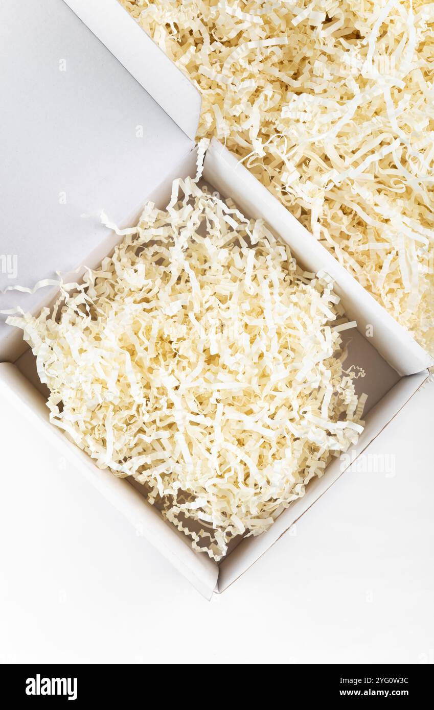 Confetti gift box filler in the box on white background Stock Photo - Alamy