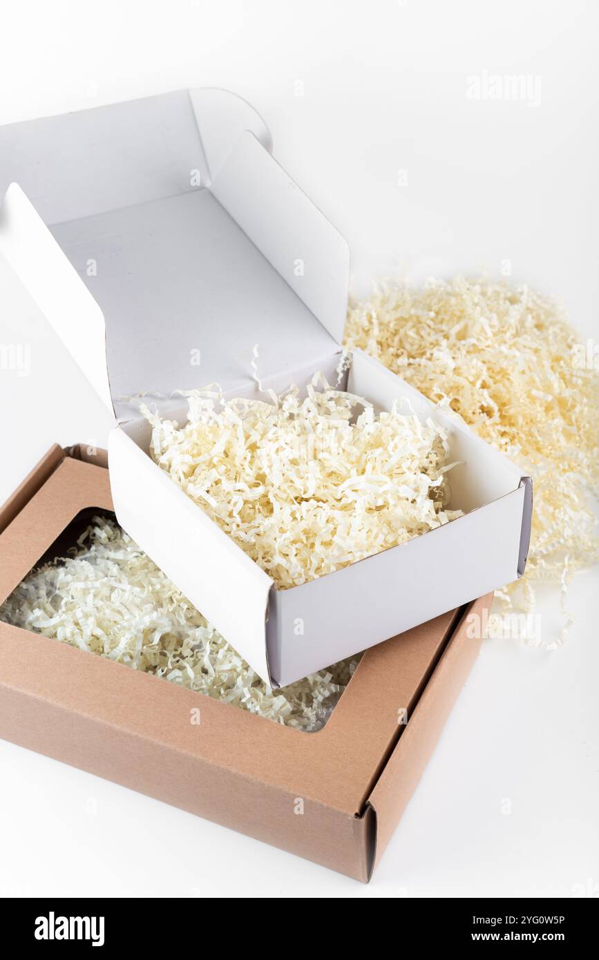 Confetti gift box filler in the box on white background Stock Photo - Alamy