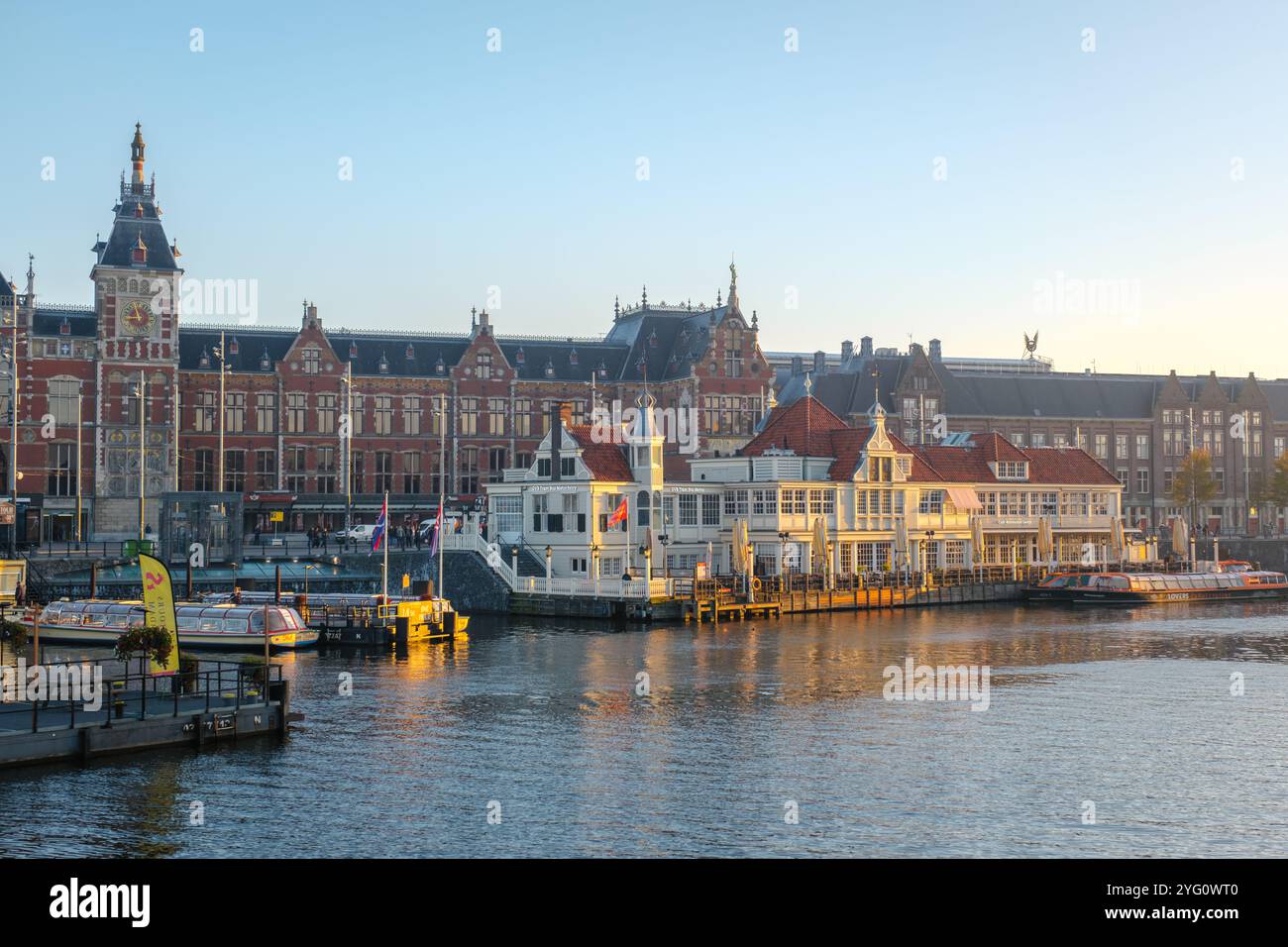 Amsterdam 23 October 2024, Golden sunlight reflects off the calm waters ...