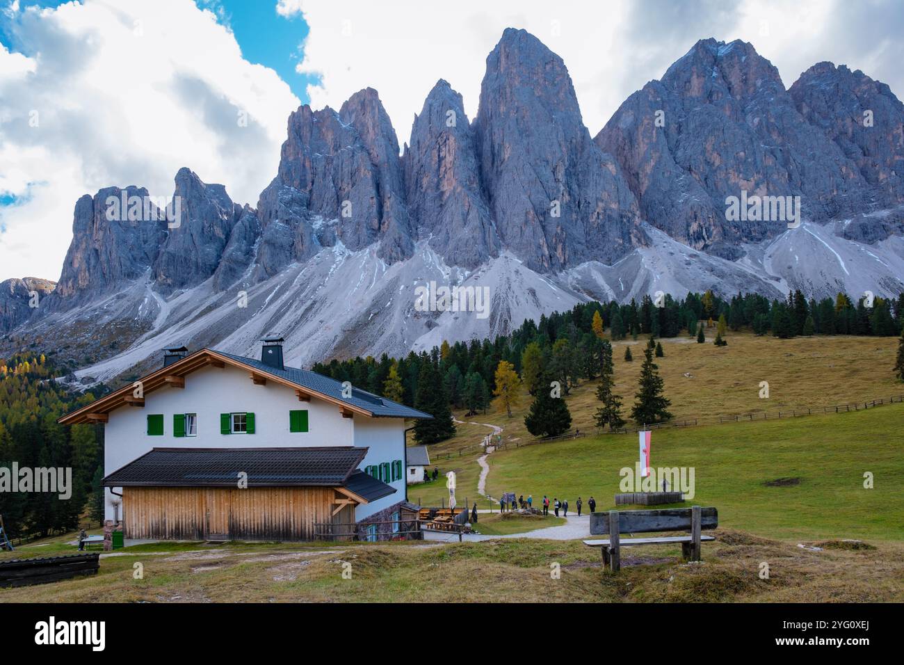 Under the vast sky, a quaint chalet sits in the foothills of the ...