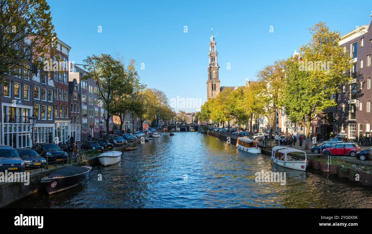 Amsterdam 23 October 2024, Golden leaves flutter down as boats glide ...