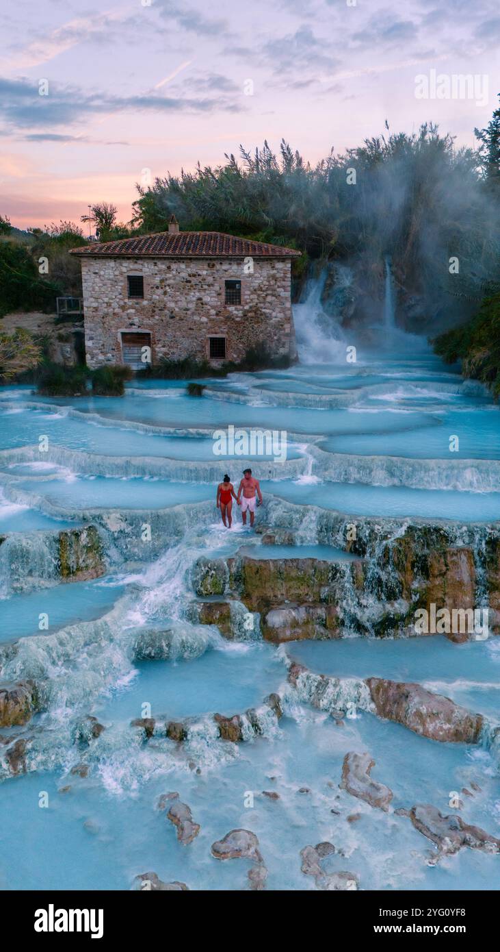 A diverse couple enjoy the soothing, natural thermal baths of Saturnia ...