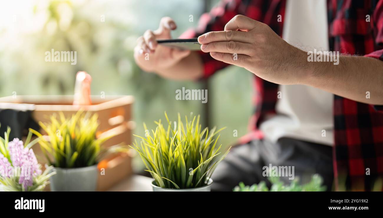 Modern Gardener Documenting Plant Growth with Smartphone Camera Stock ...