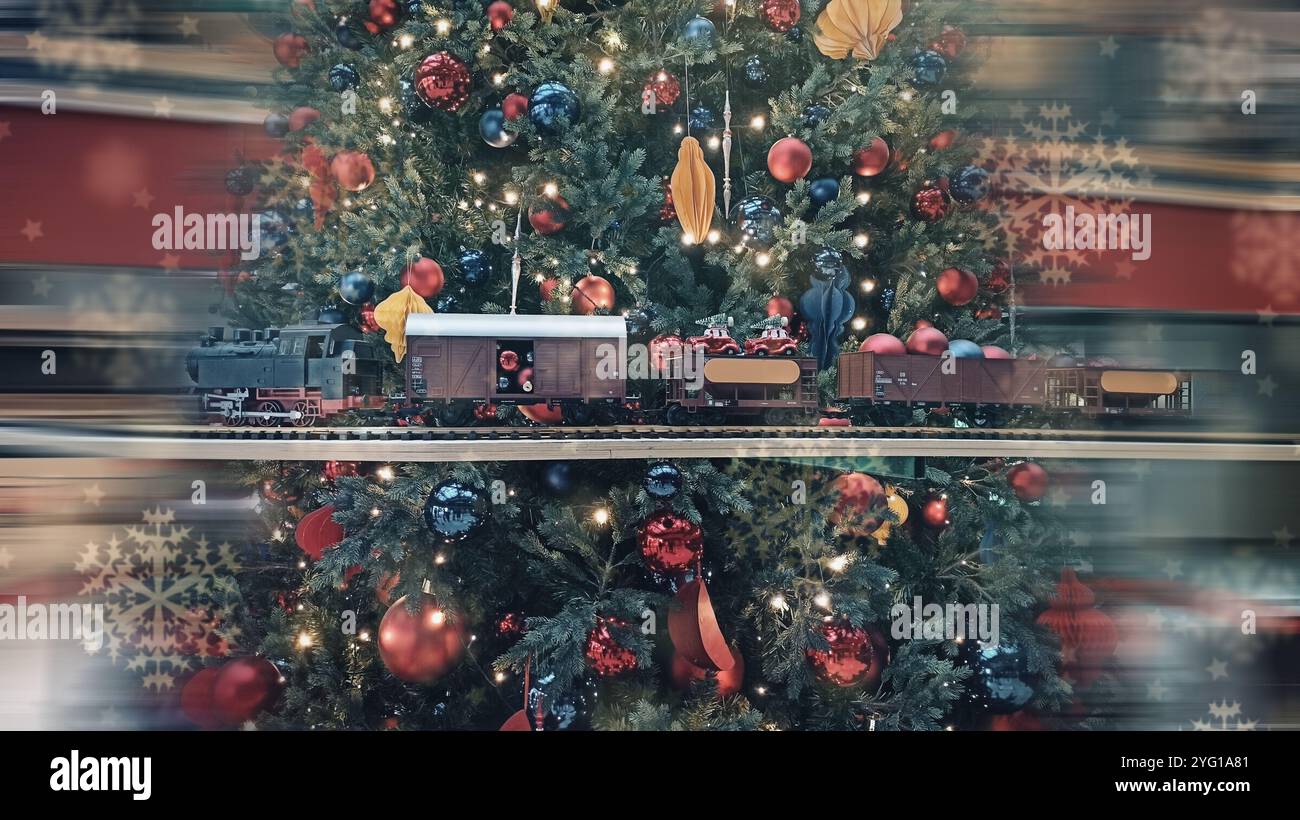Toy train around christmas tree hi-res stock photography and images - Alamy