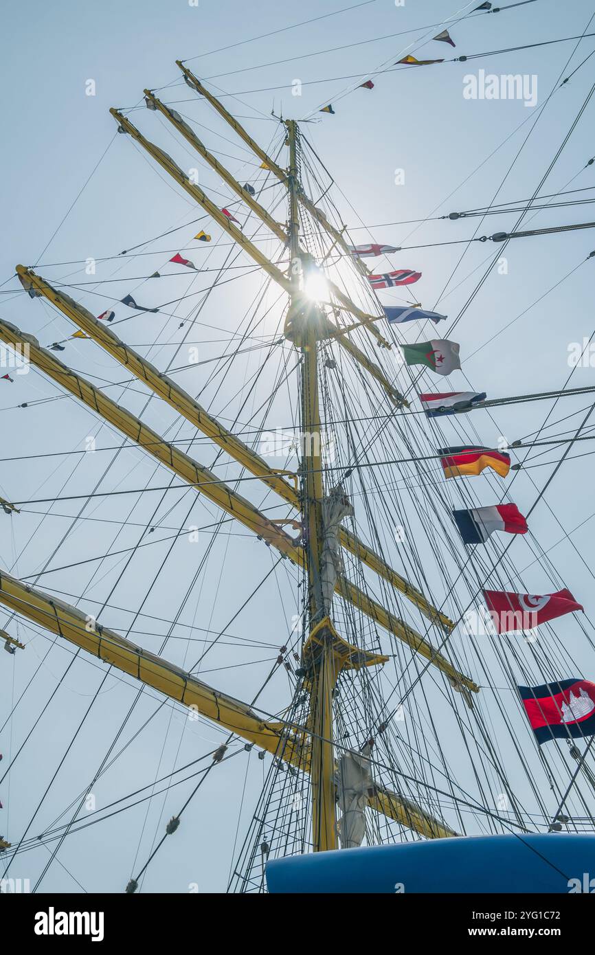 The magnificent mast of the Bima Suci sailing ship with ropes and flags ...