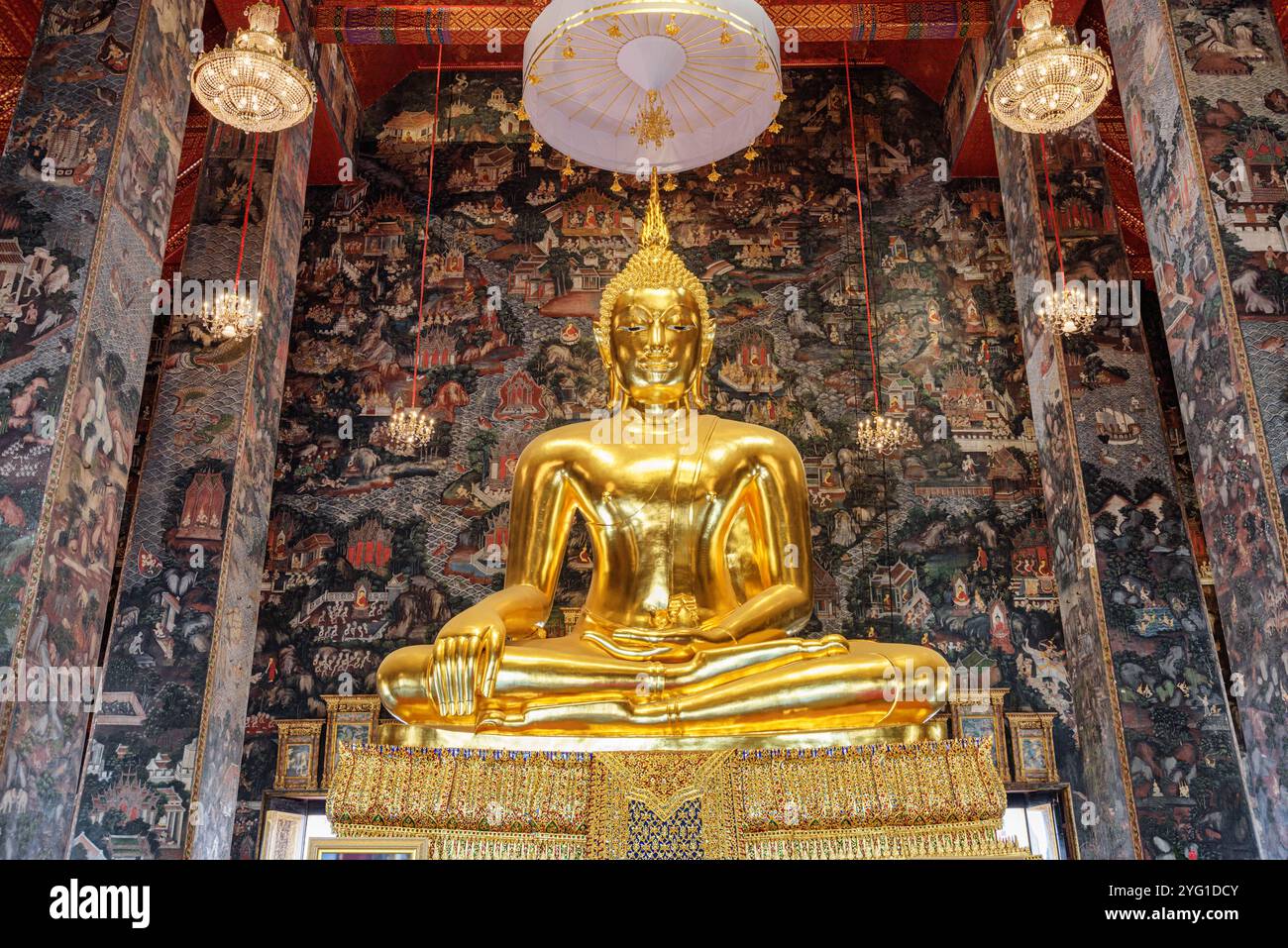 Awesome view of gilded Buddha statue among amazing murals Stock Photo ...