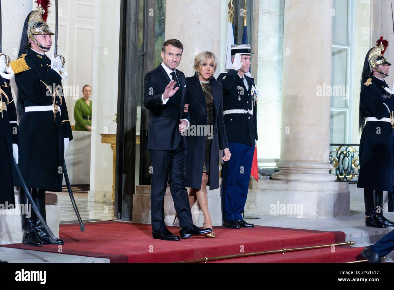 French President Emmanuel Macron (L) and his wife Brigitte Macron wait ...