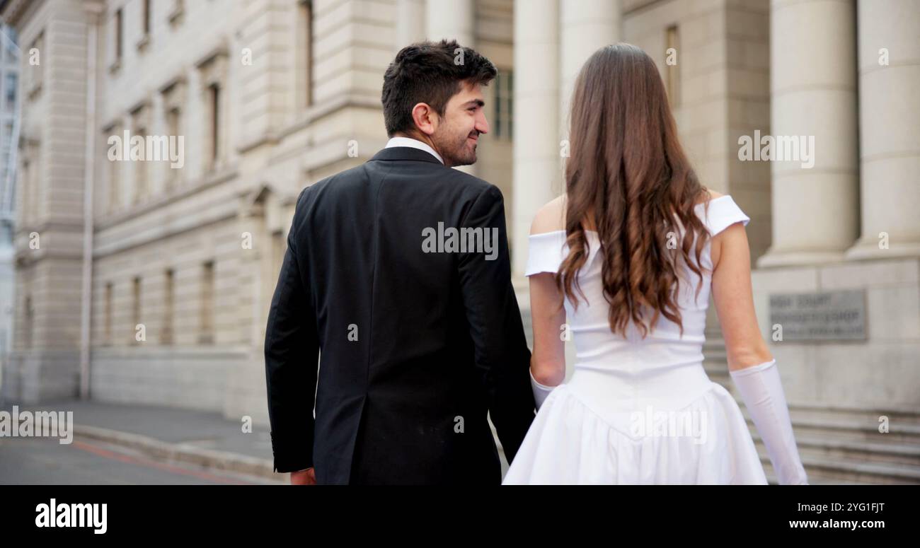 City, building and couple at wedding with love, walking and bride with ...