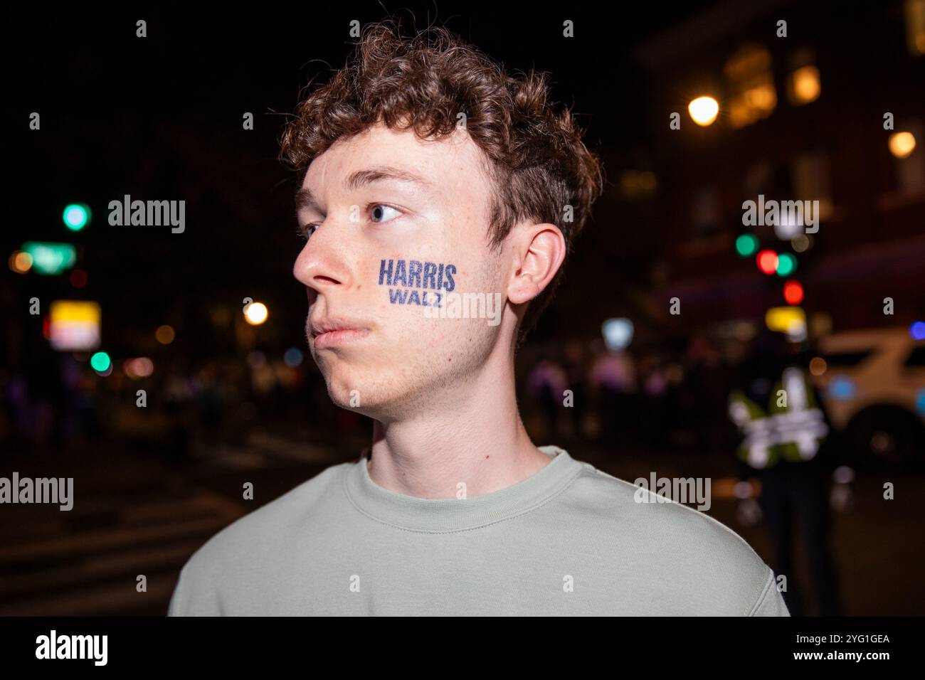 A person displays a tattoo with the text ''Harris Walz'' during an ...