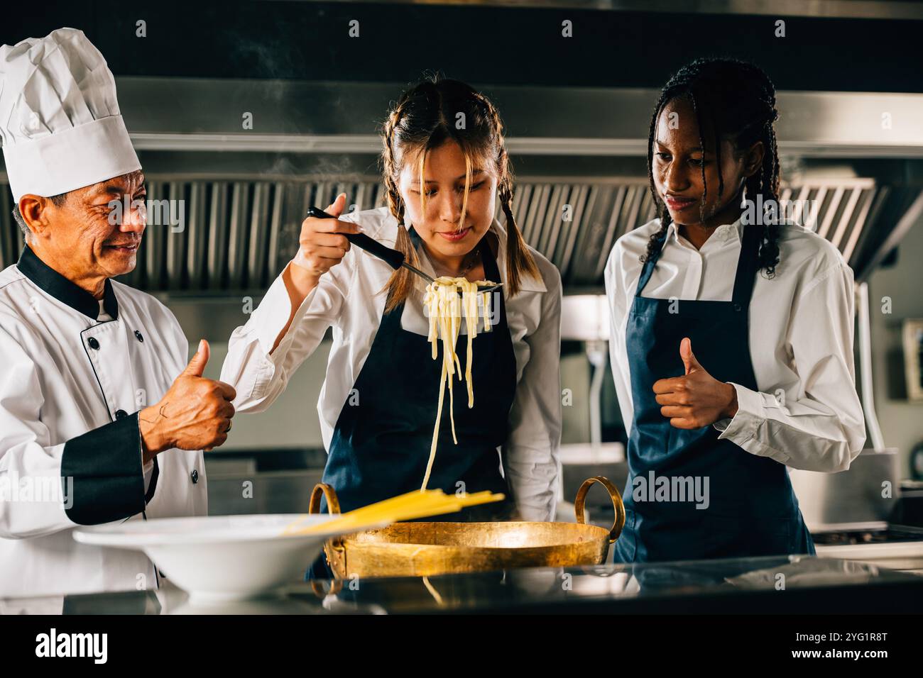 In kitchen chef mentors students. Schoolgirls create ramen. Kids and ...