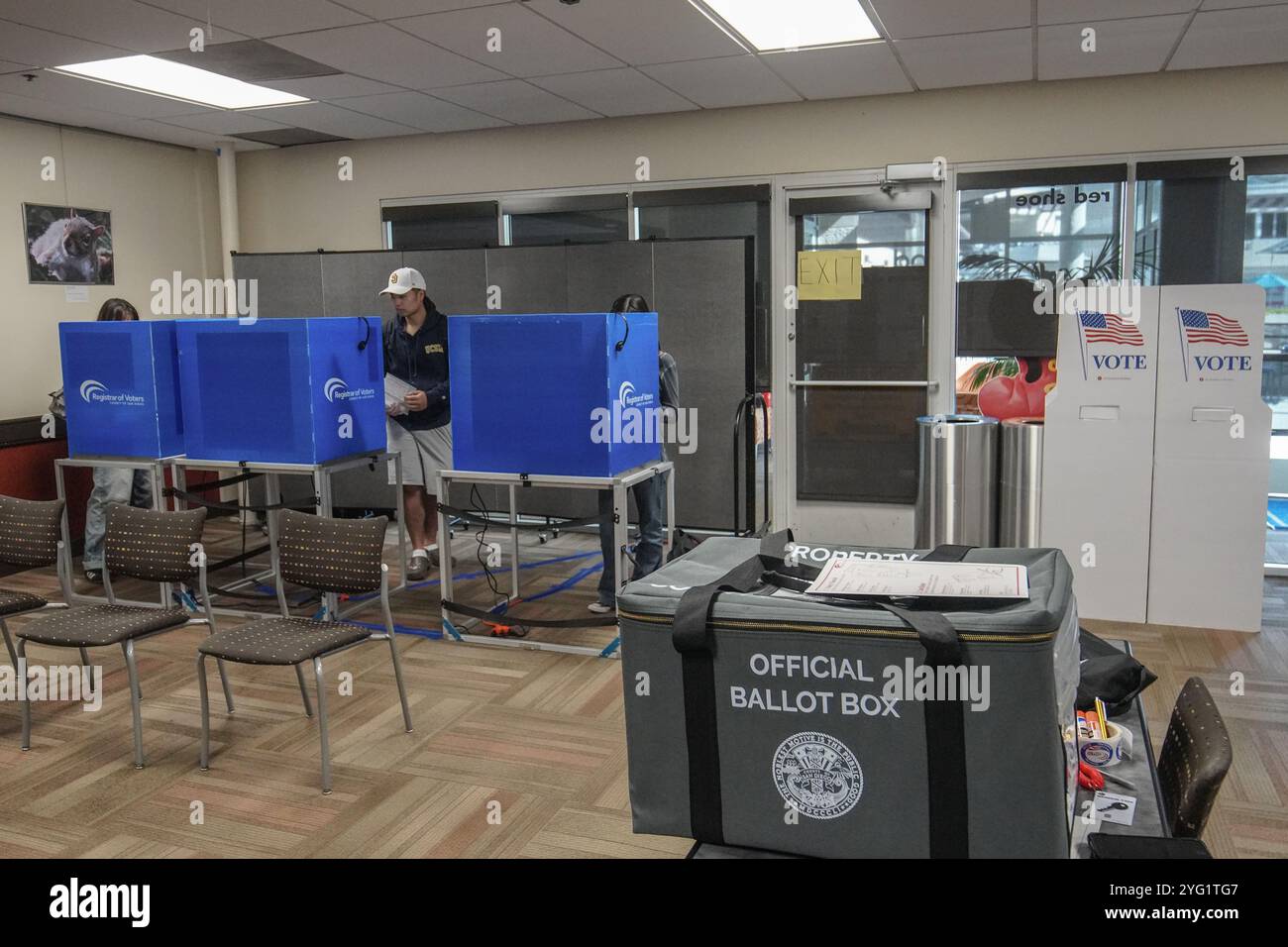 People vote inside one of the vote centers at University of California ...