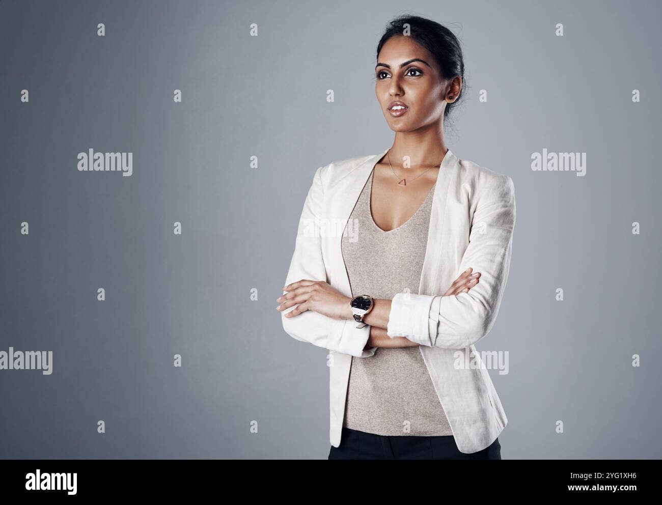 Employee, woman and thinking with arms crossed in studio for ideas ...