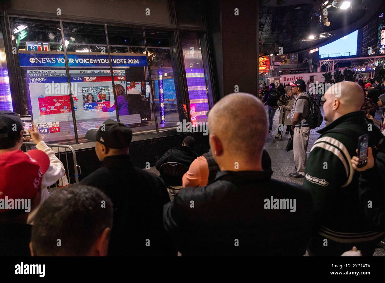 People watch an ABC News livestream showing poll results in Times ...